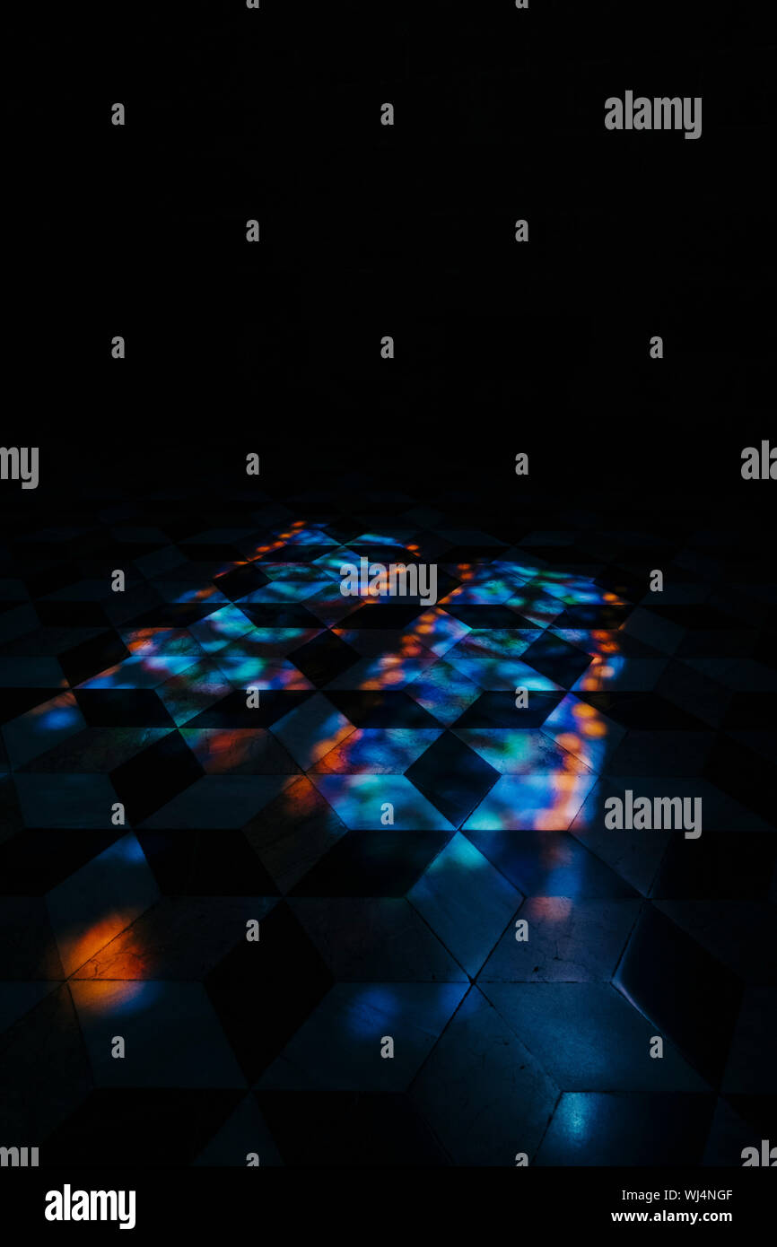 Kaleidoscope reflection of lights on tile floor Stock Photo - Alamy