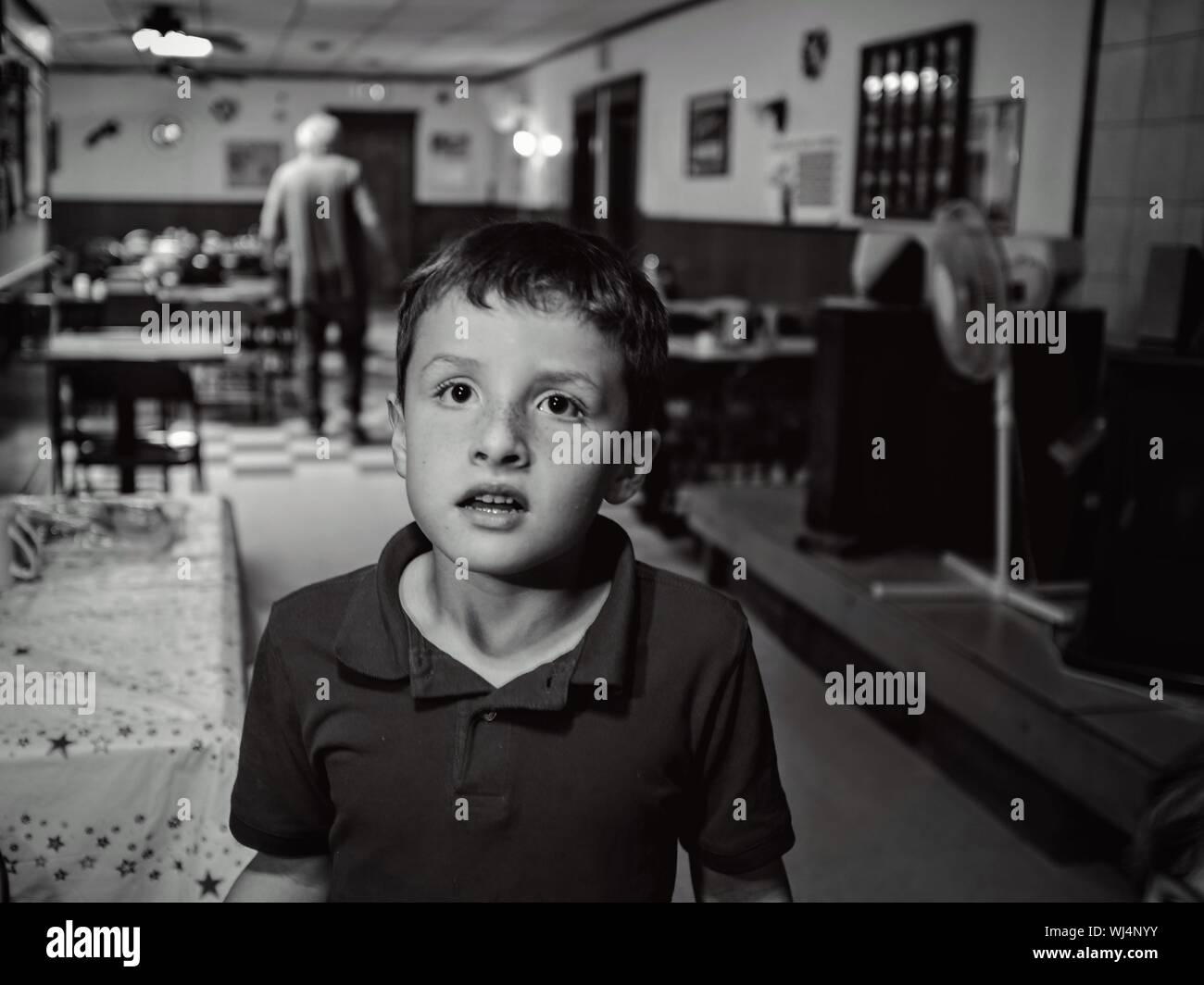 Boy standing looking at camera hi-res stock photography and images - Alamy