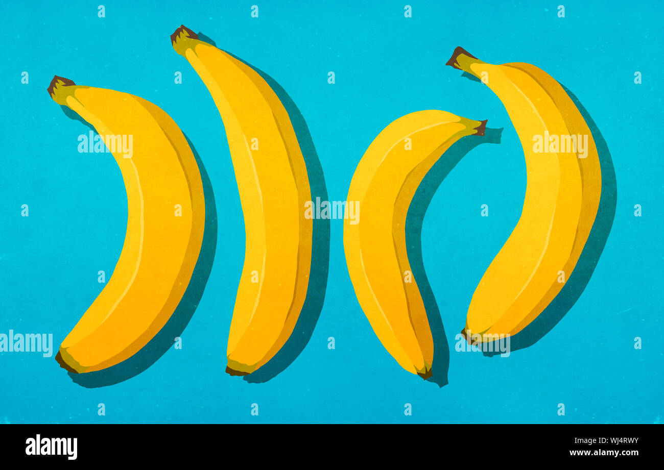 Vibrant, unpeeled yellow bananas on blue background Stock Photo - Alamy