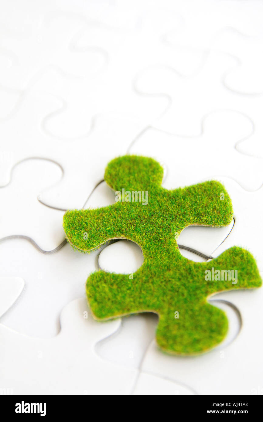 green puzzle piece concept Stock Photo - Alamy