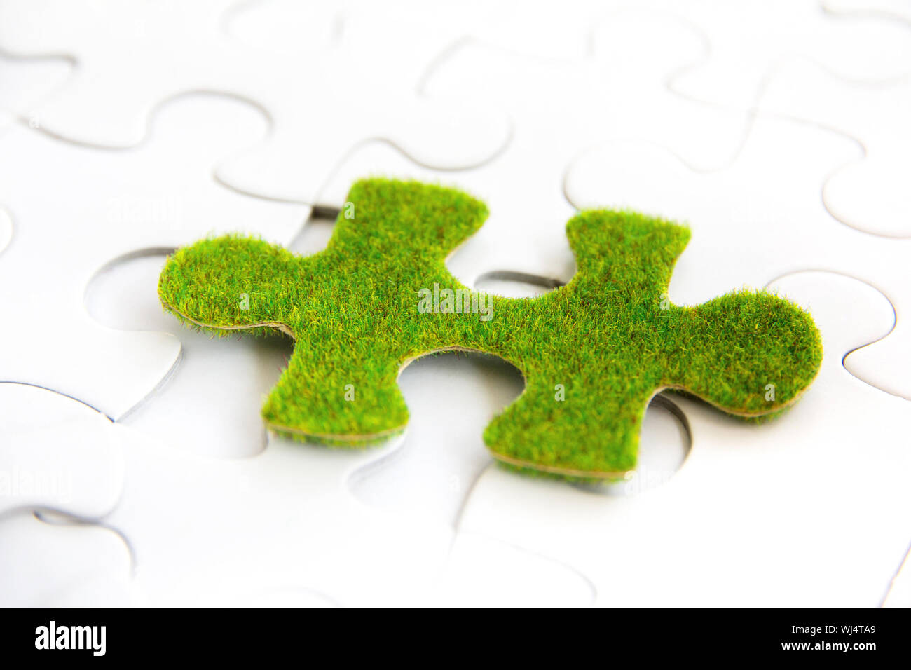 green puzzle piece concept Stock Photo - Alamy