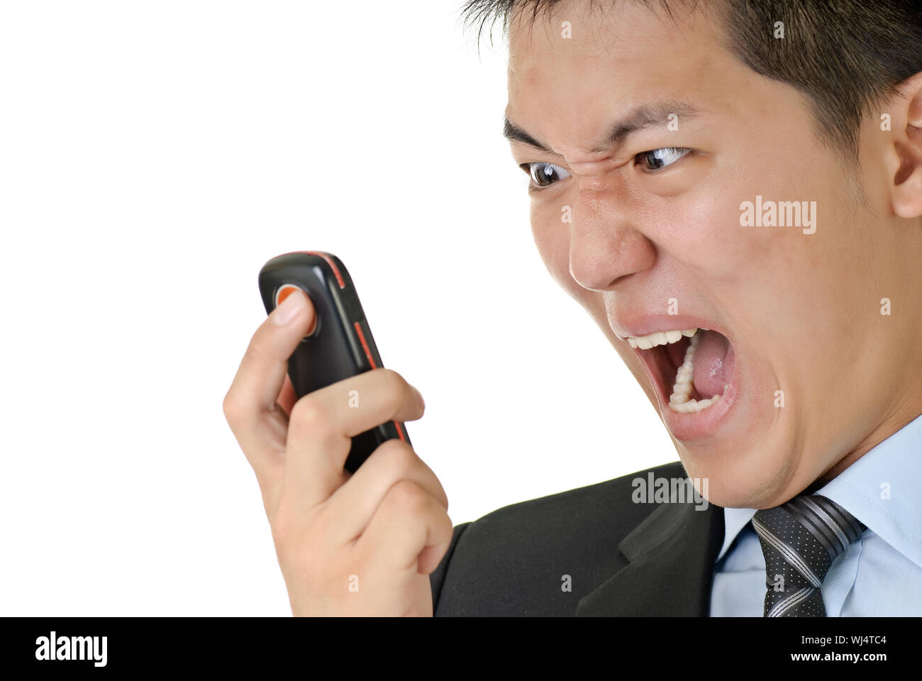 Business man yell to phone, closeup portrait of Asian with angry ...