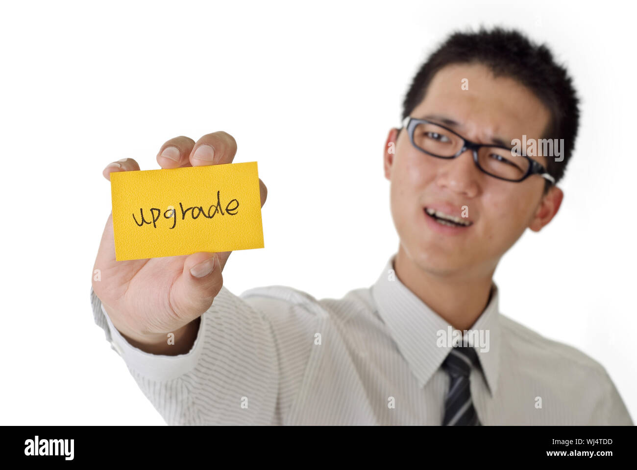 Business man want to upgrade and holding yellow card on white ...