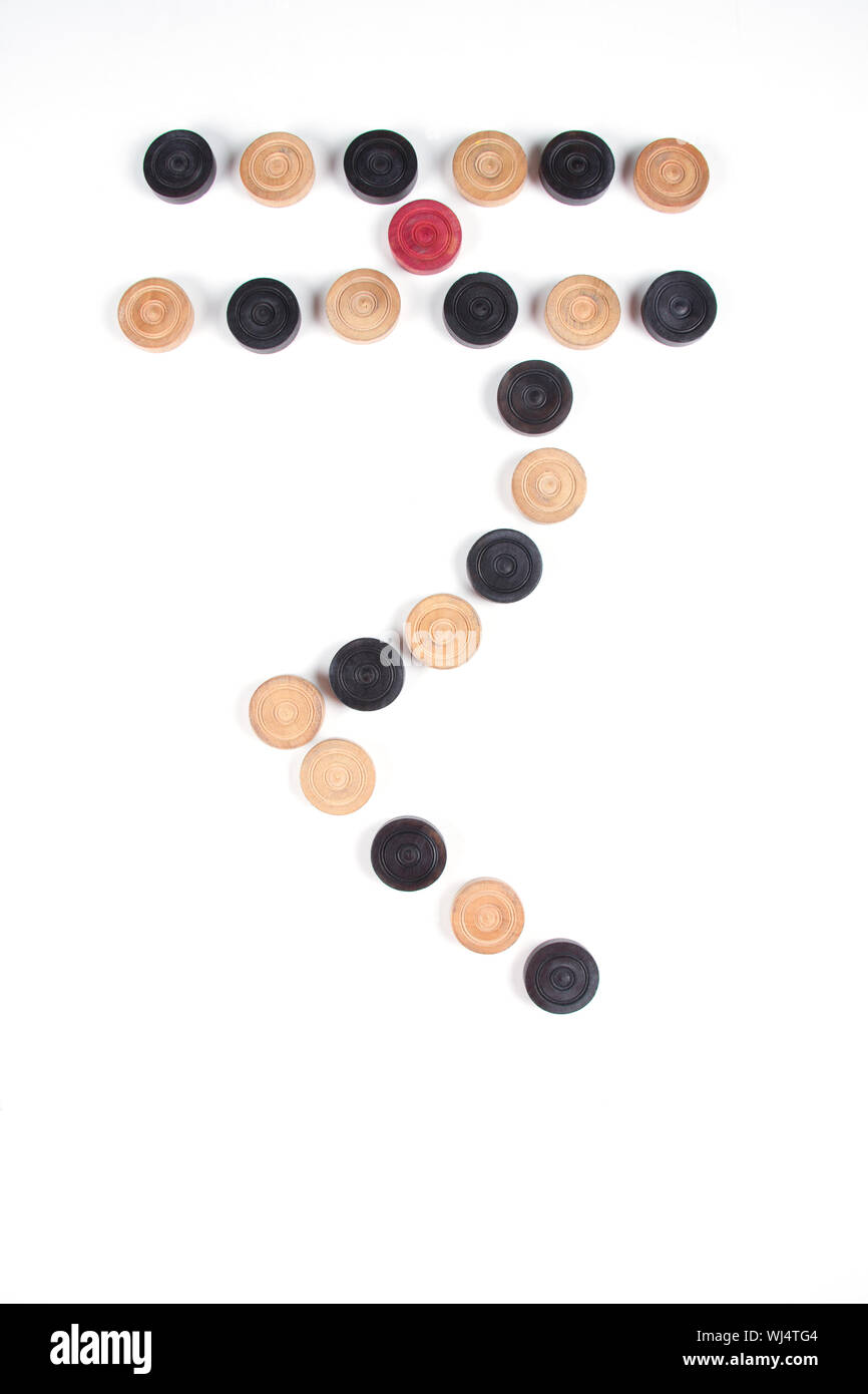Carrom pieces in shape of Indian rupee symbol Stock Photo - Alamy