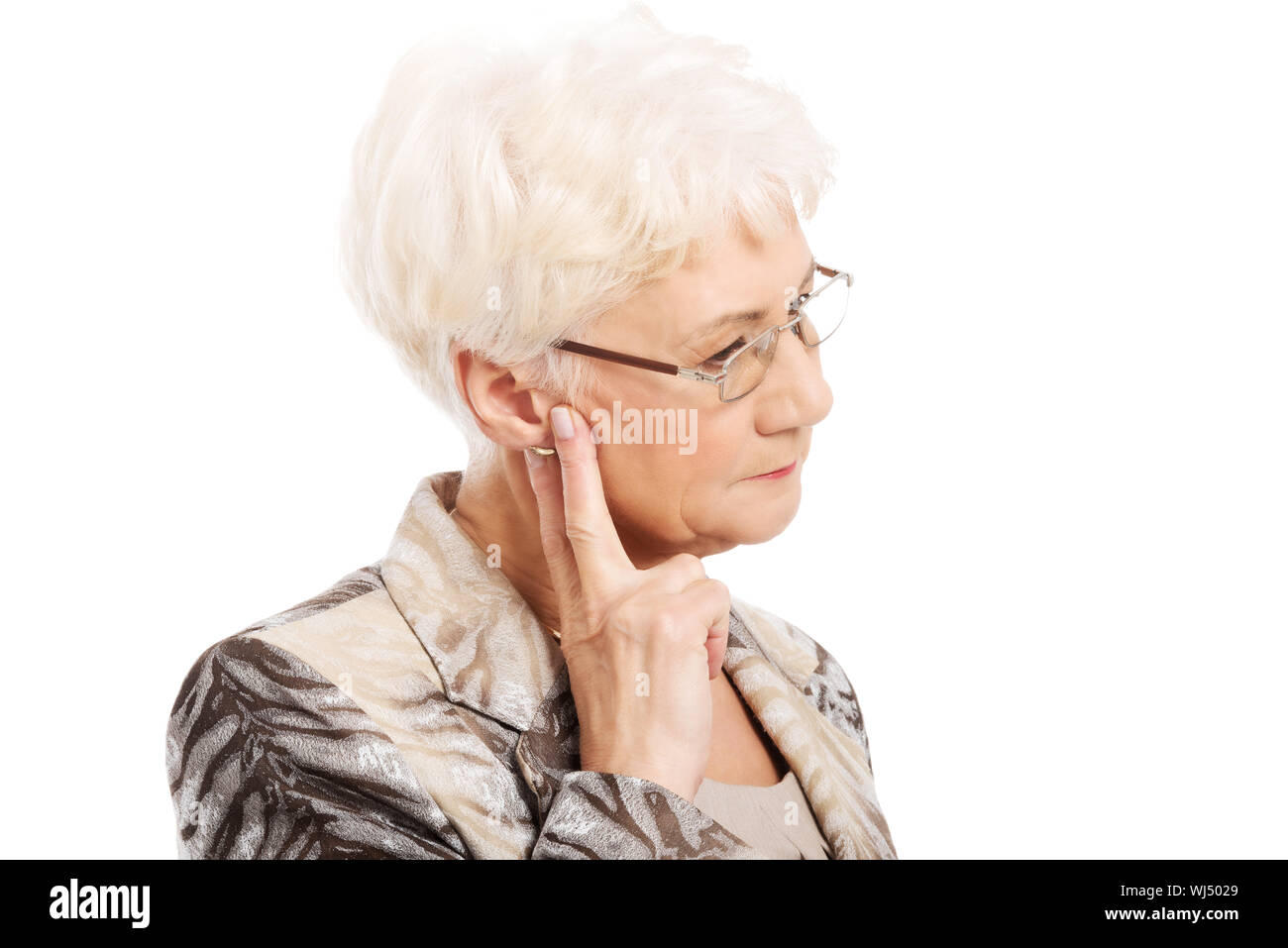 An old elegant lady touching her temple. Isolated on white Stock Photo ...