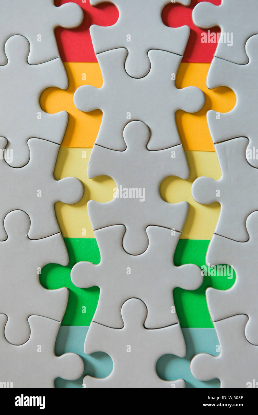 Rainbow edges of disconnected jigsaw puzzle pieces Stock Photo - Alamy