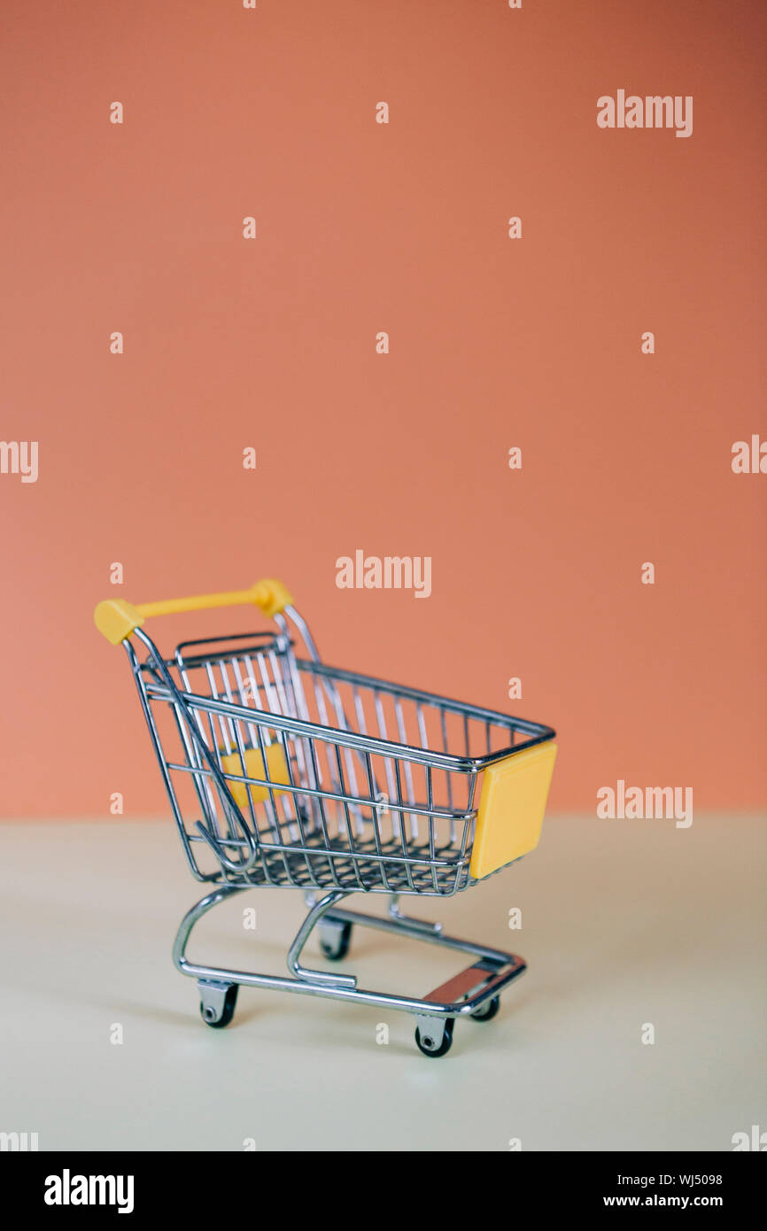 Tiny toy shopping cart Stock Photo - Alamy