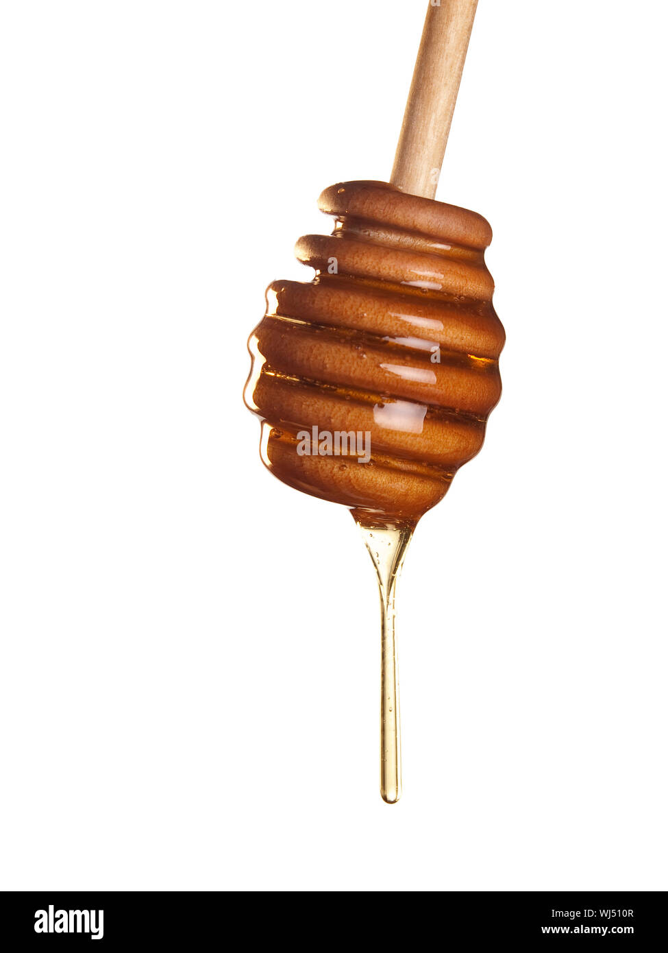 Honey falling from wooden dipper hi-res stock photography and images ...