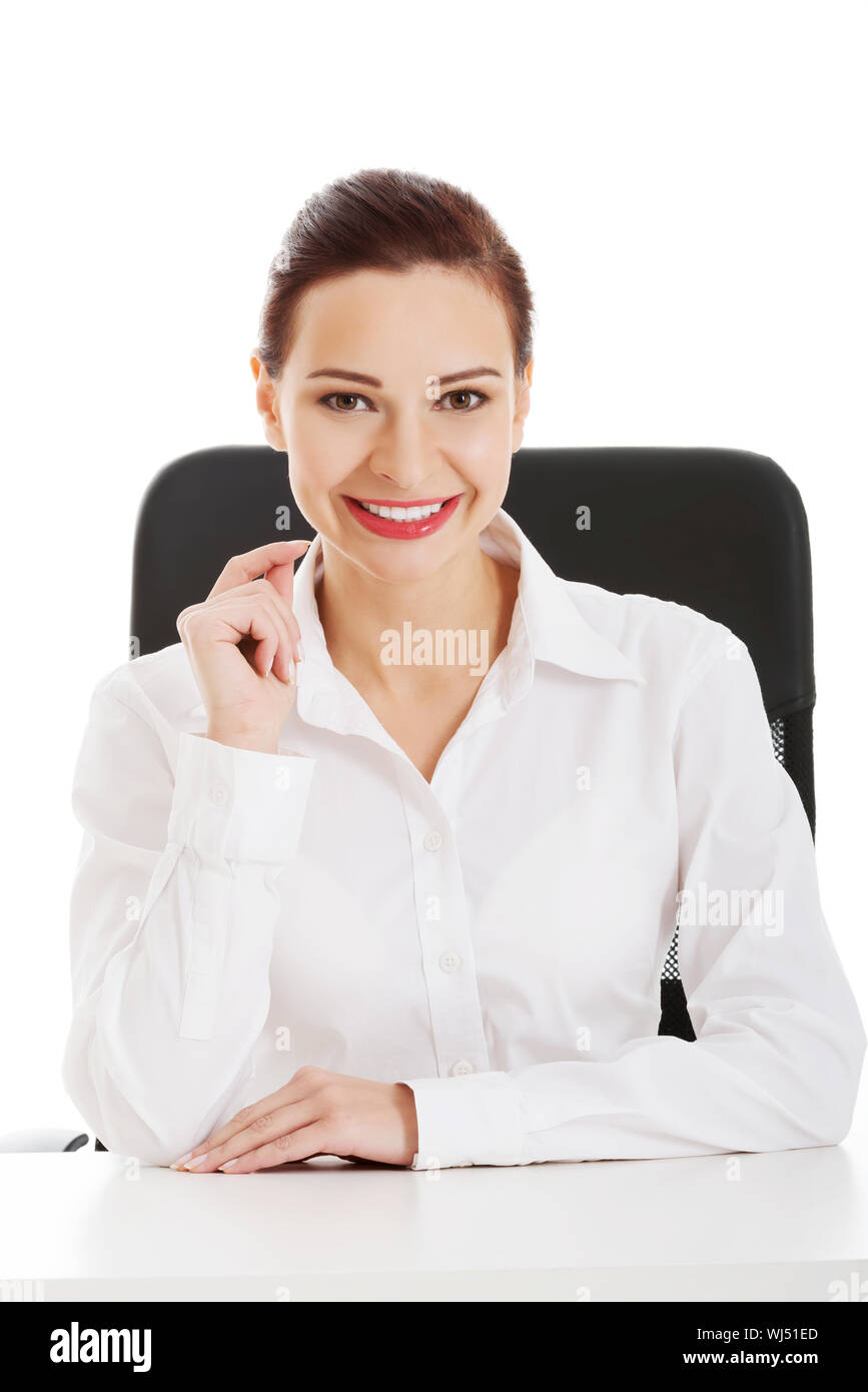 Beautiful business woman, boss sitting on a chair. Isolated on white ...