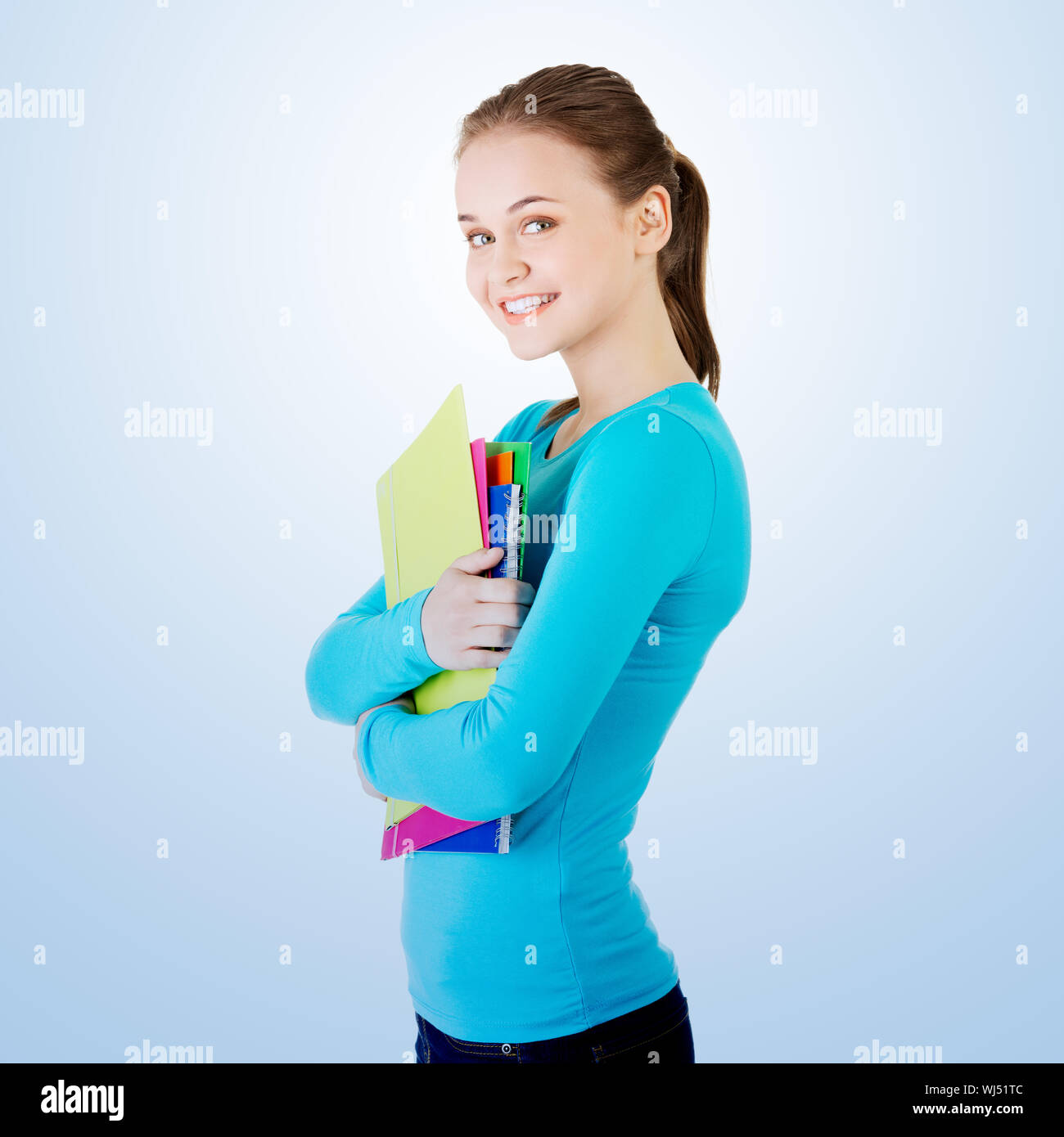 Happy student girl with notebooks Stock Photo - Alamy