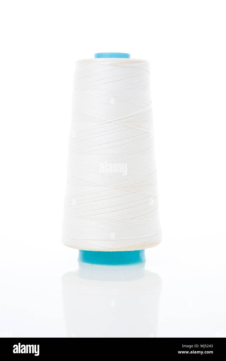 Bobbin of white thread isolated on white background with reflection ...