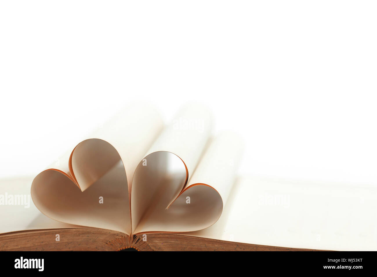 Heart made of blank pages inside a book on white background Stock Photo ...