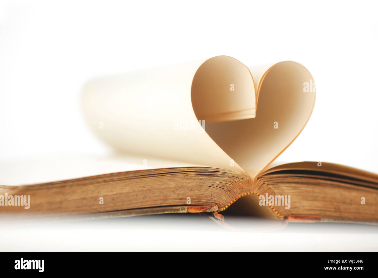 Heart made of blank pages inside a book on white background Stock Photo ...