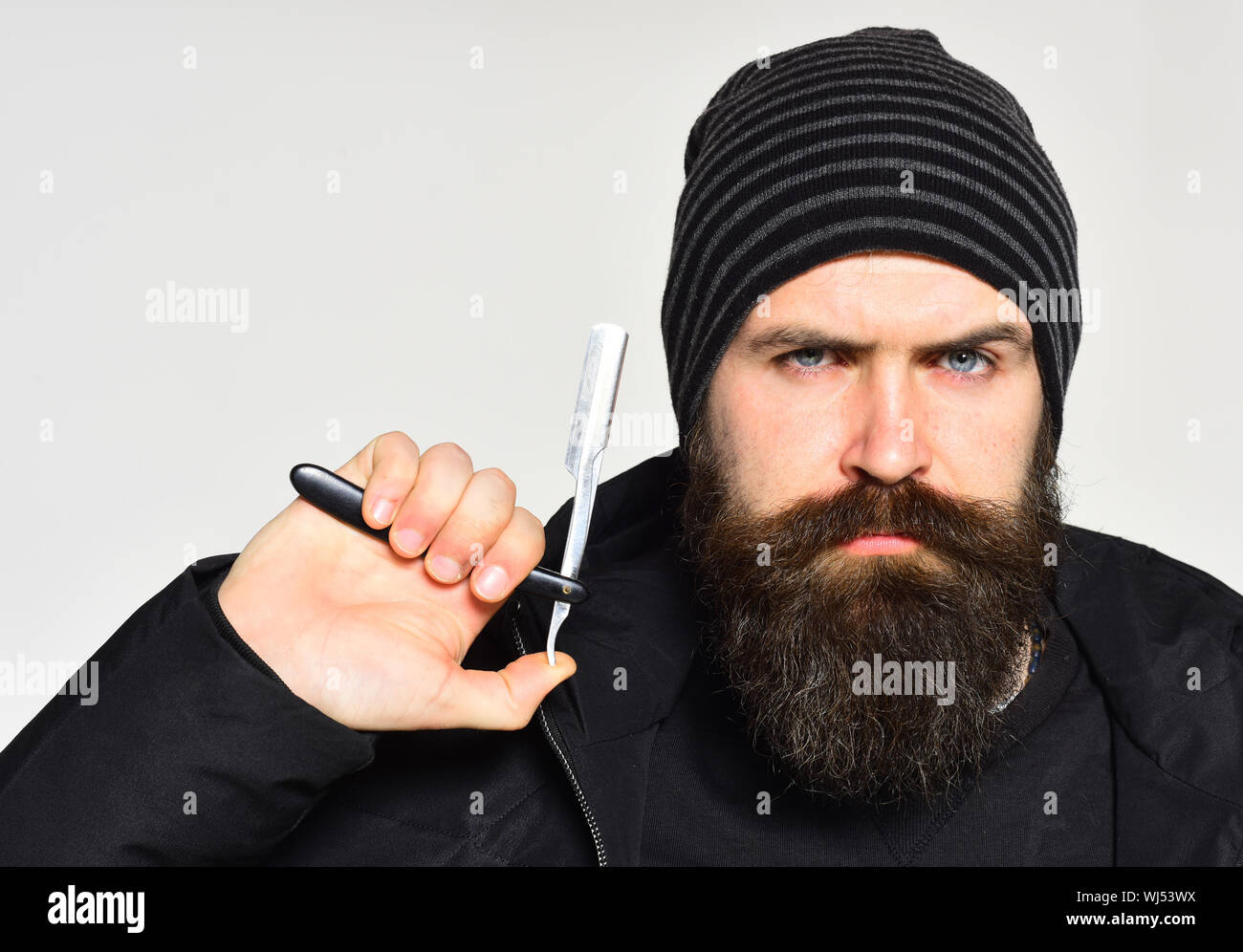 Barbershop, hairstyle concept - Bearded stylish young hipster is about ...