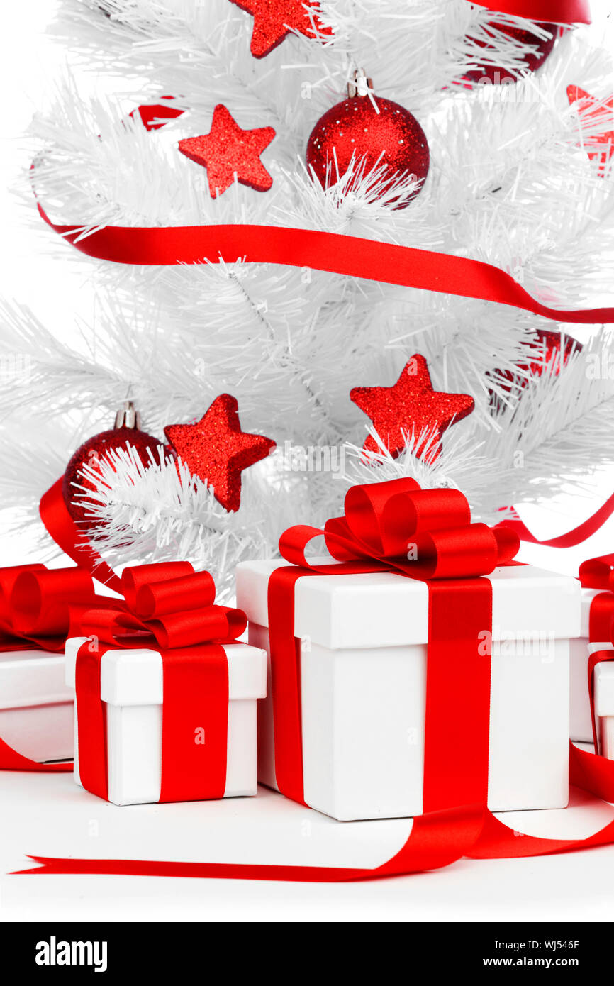 Christmas tree and gifts isolated on white background Stock Photo - Alamy