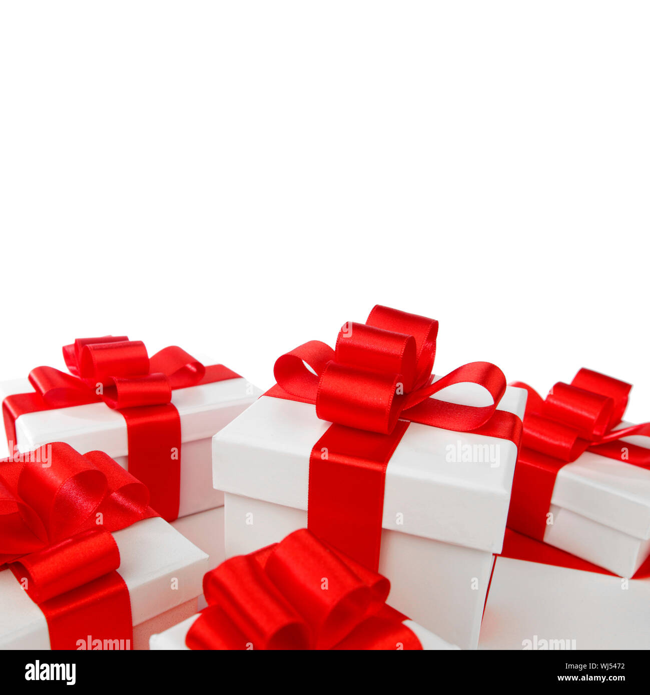 Gift boxes with red ribbon bows on white background Stock Photo - Alamy
