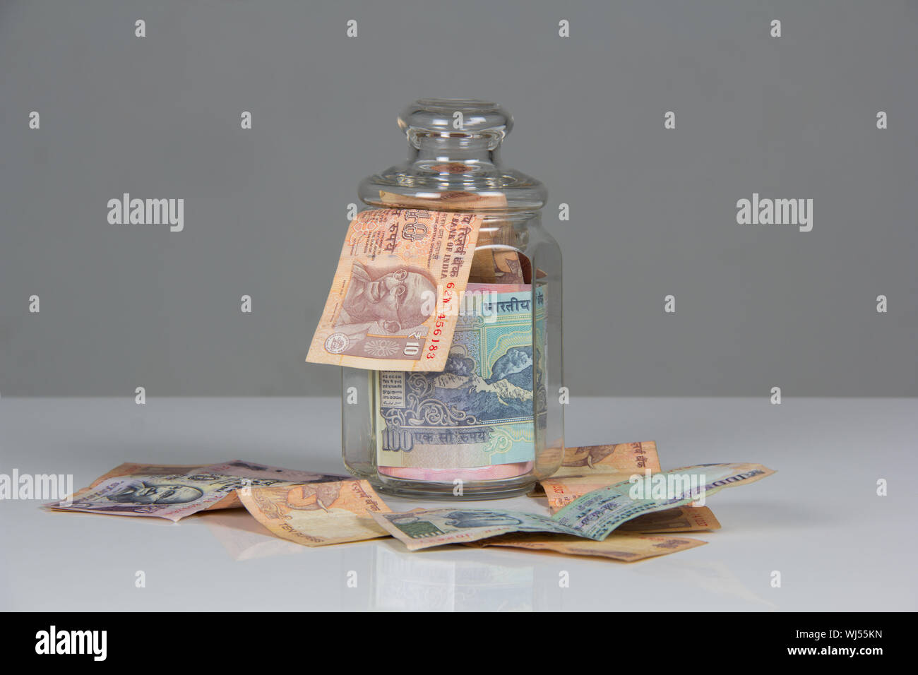 Close up of a jar full of money Stock Photo - Alamy