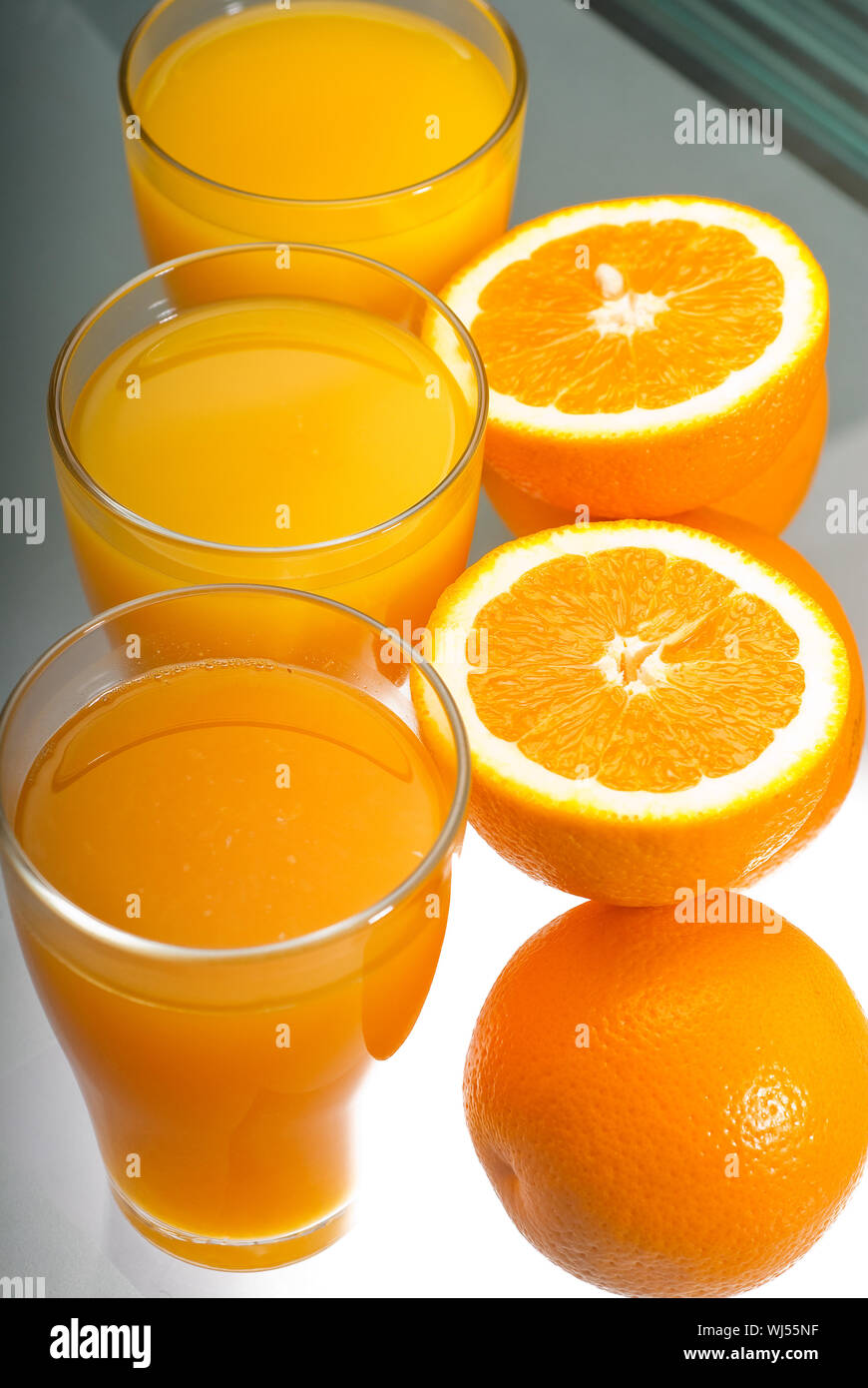 fresh and healthy orange juice ,unfiltered ,over a light table Stock ...