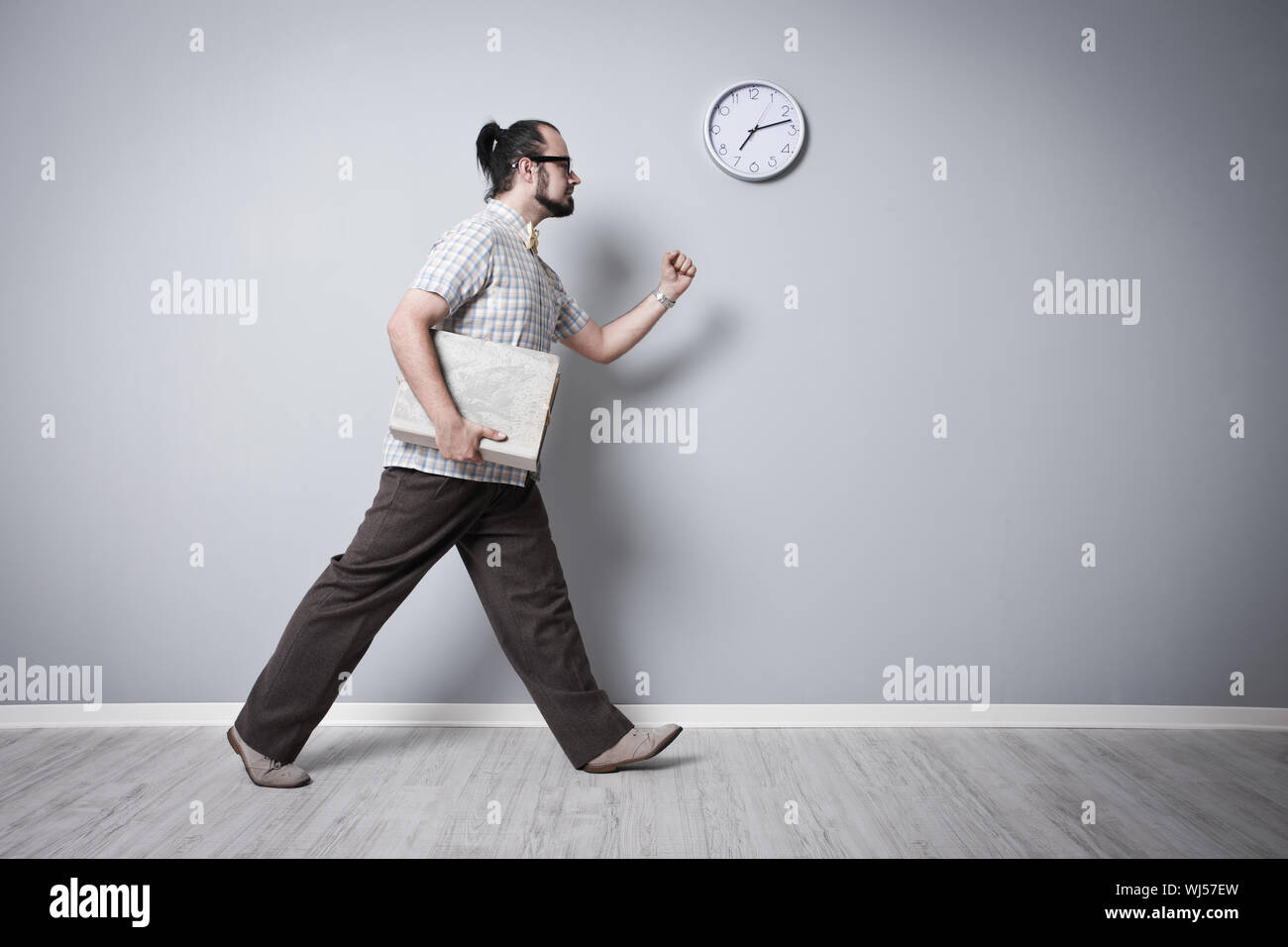 Stressed business man rushing in the office Stock Photo - Alamy