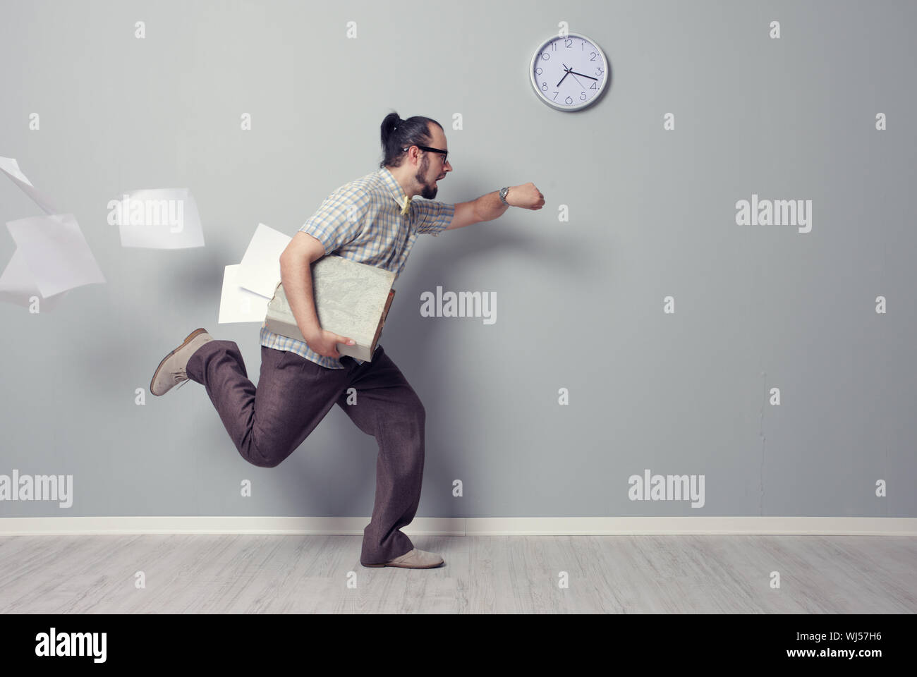 Stressed business man rushing in the office Stock Photo - Alamy