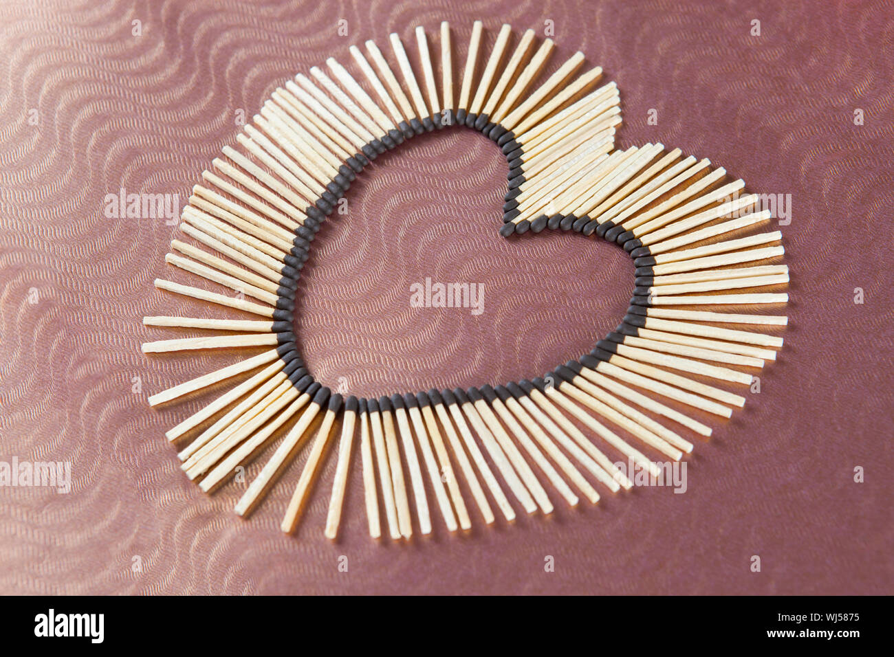 Matchsticks in shape of heart symbol Stock Photo - Alamy