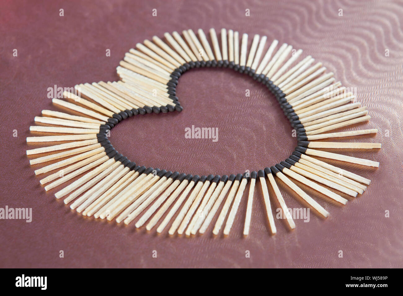 Matchsticks in shape of heart symbol Stock Photo - Alamy