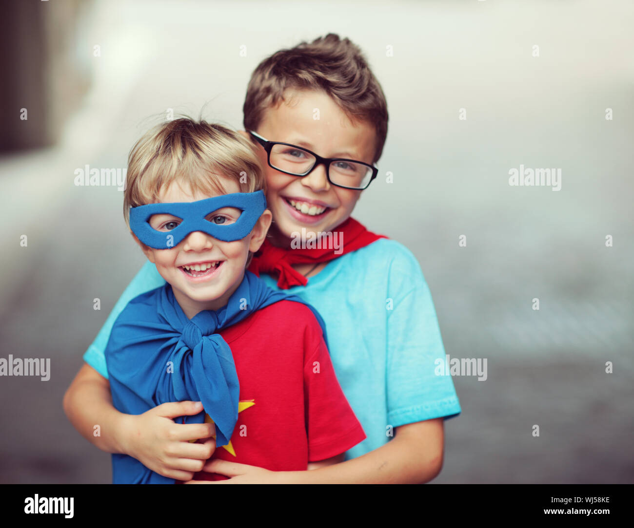 Portrait of two little cheerful superheroes Stock Photo - Alamy