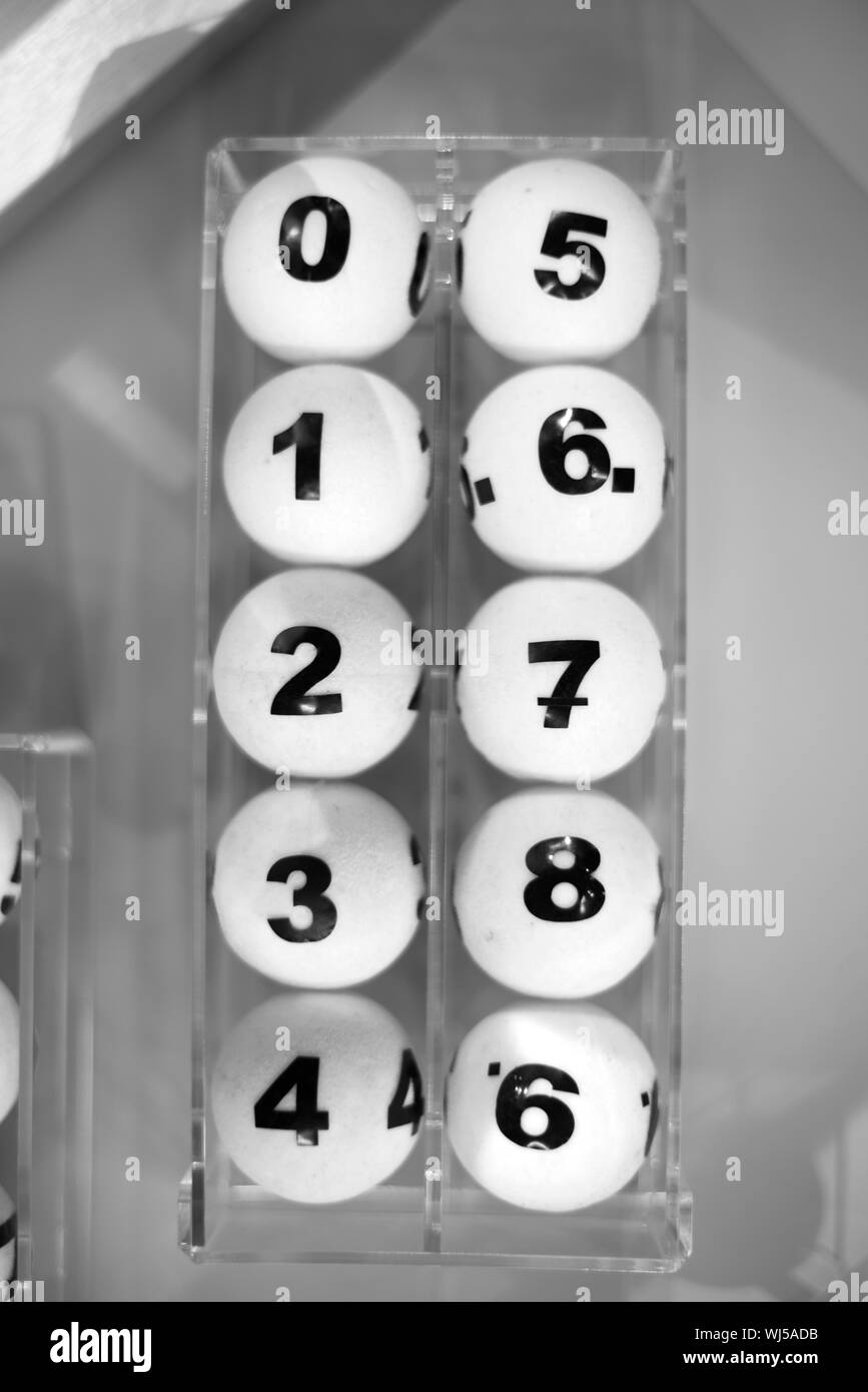 white balls with numbers for the game of lottery Stock Photo - Alamy
