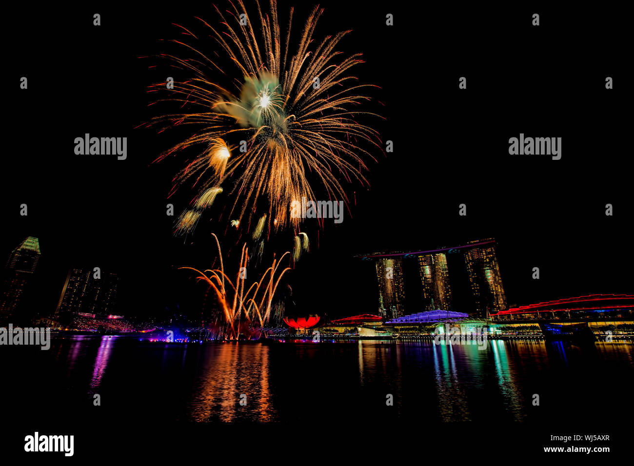 Fireworks over Marina bay in Singapore on National day Stock Photo - Alamy