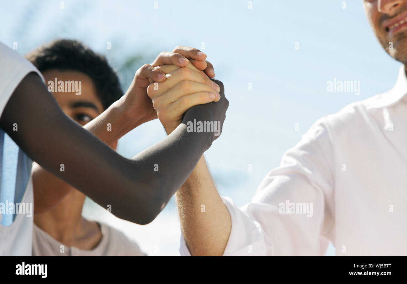 Multi-Ethnic people shaking hands, close up Stock Photo - Alamy