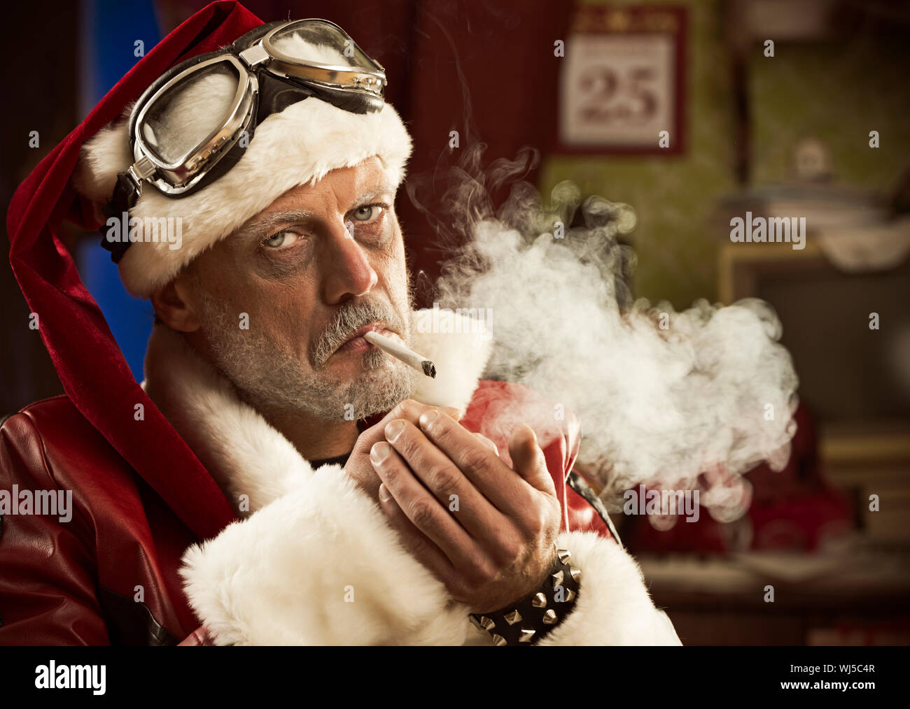 Portrait of a frowning Bad Santa smoking a joint Stock Photo - Alamy