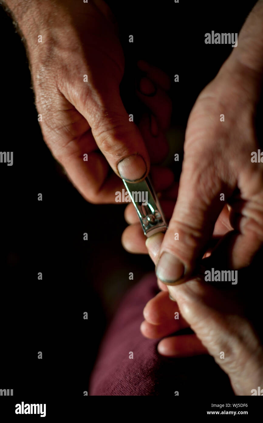 Cutting fingernails hi-res stock photography and images - Alamy