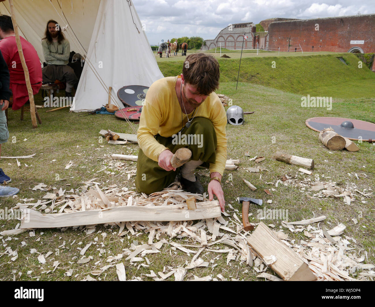 A dark ages living history reenactor gives a demonstration Riving or ...