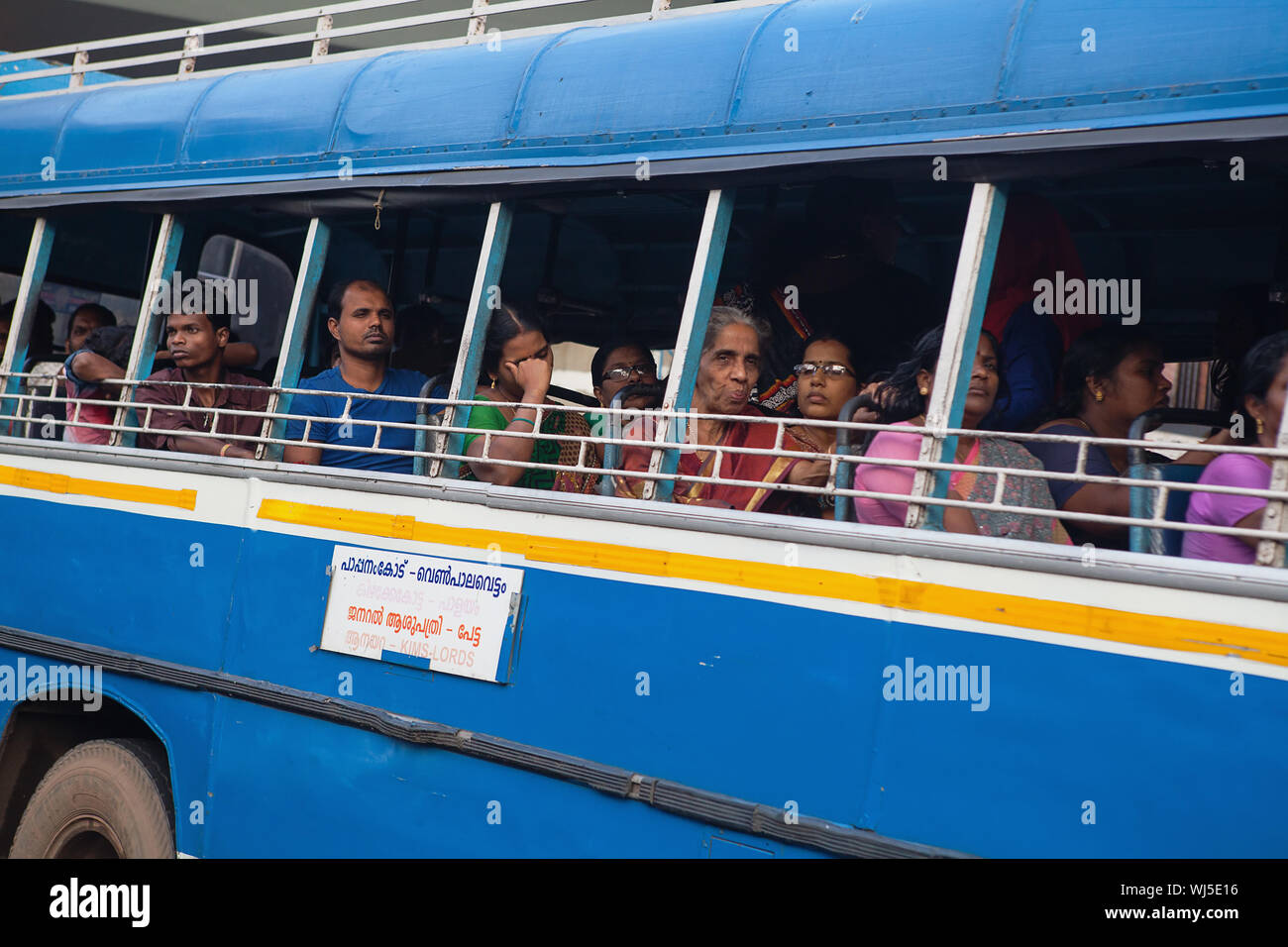 India, Kerala, Thiruvananthapuram, Passengers on a public bus in ...