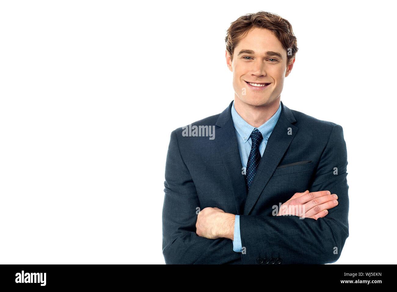 Handsome corporate guy posing confidently Stock Photo - Alamy