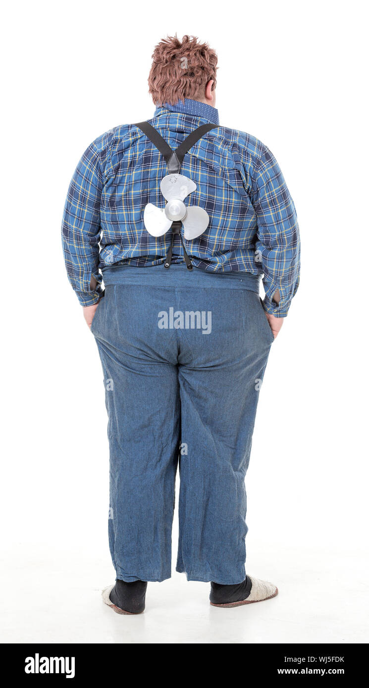 Overweight obese young man standing with his back and a small propeller ...