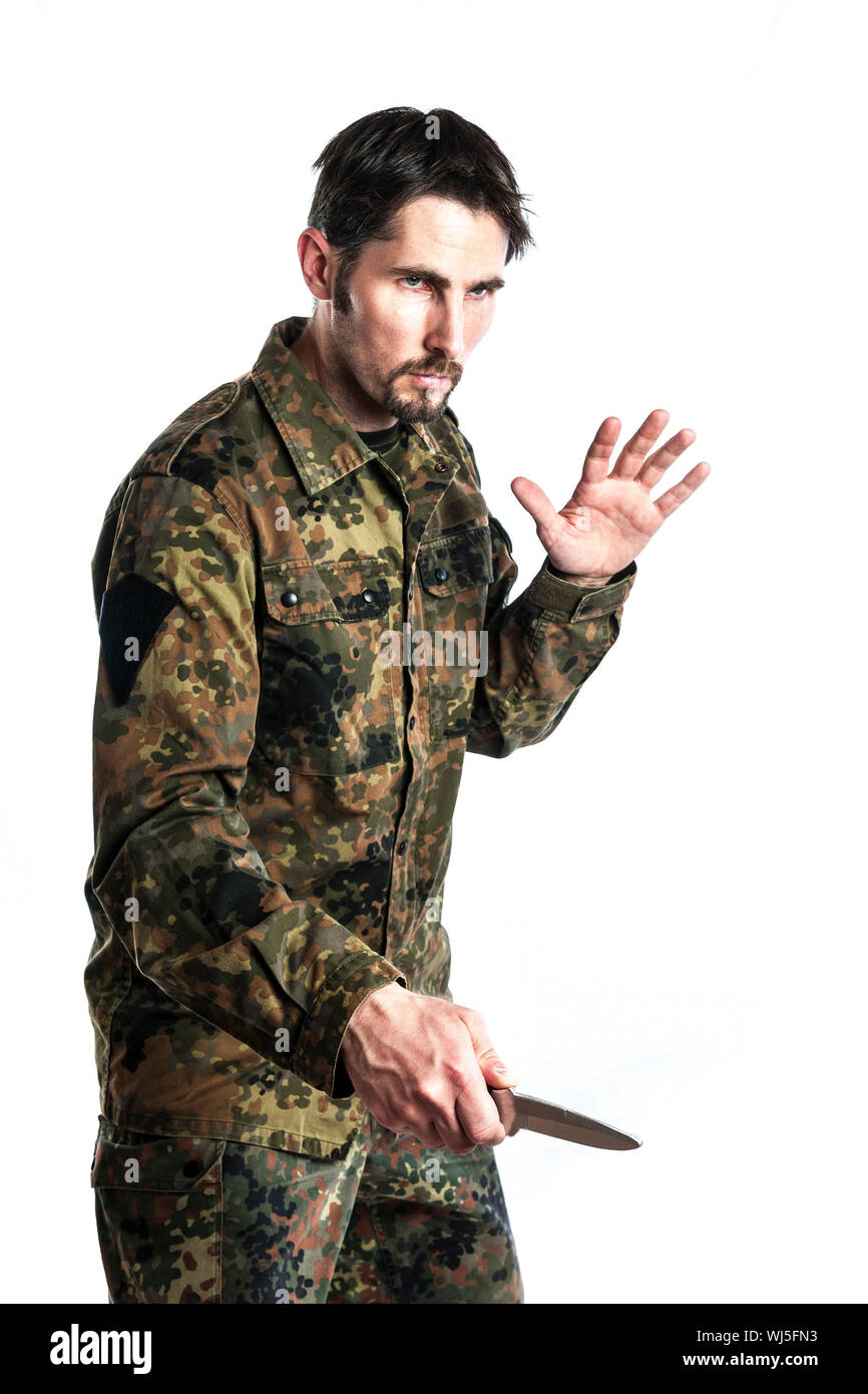 Male self defense instructor with camouflage do a self defense exercise ...