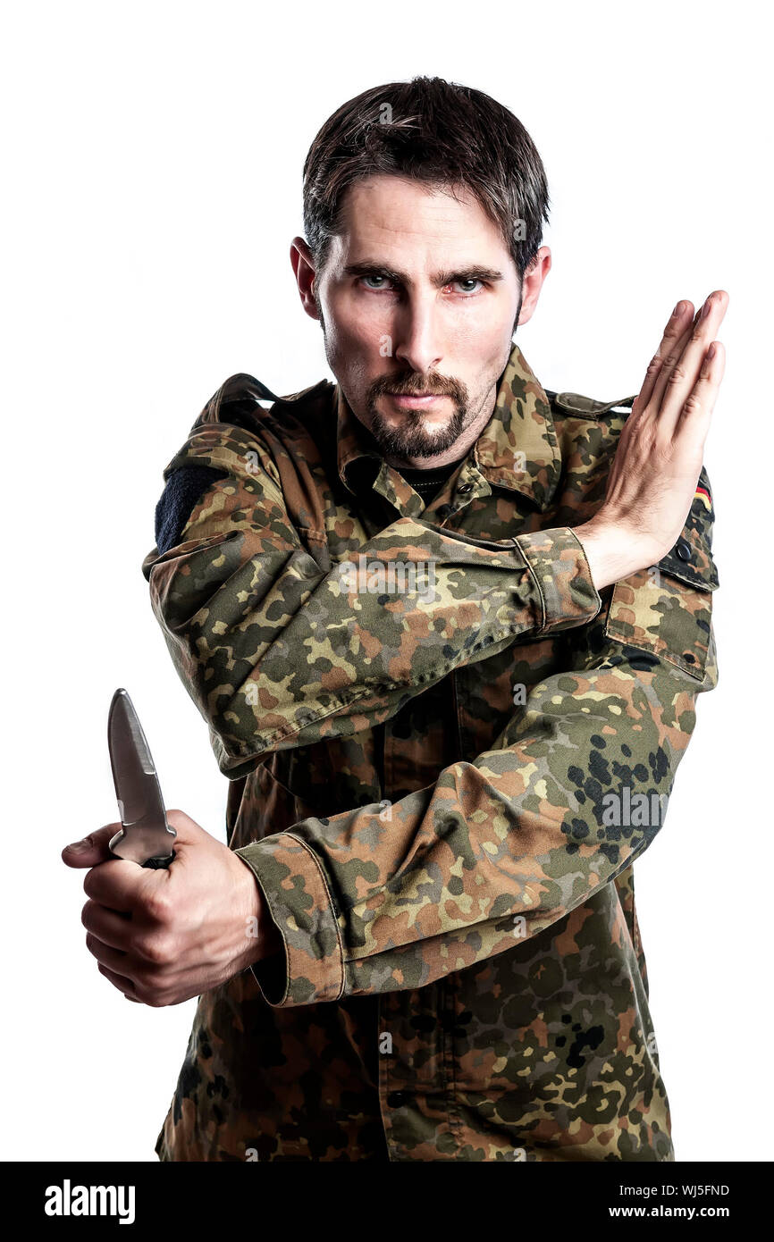 Male self defense instructor with camouflage do a self defense exercise ...