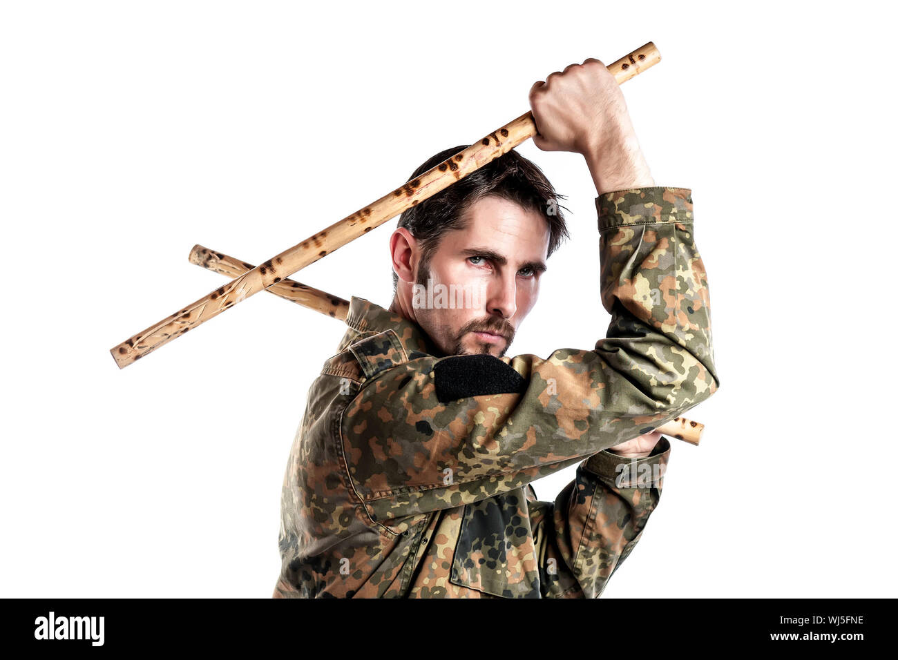 Male self defense instructor with camouflage do a self defense exercise ...
