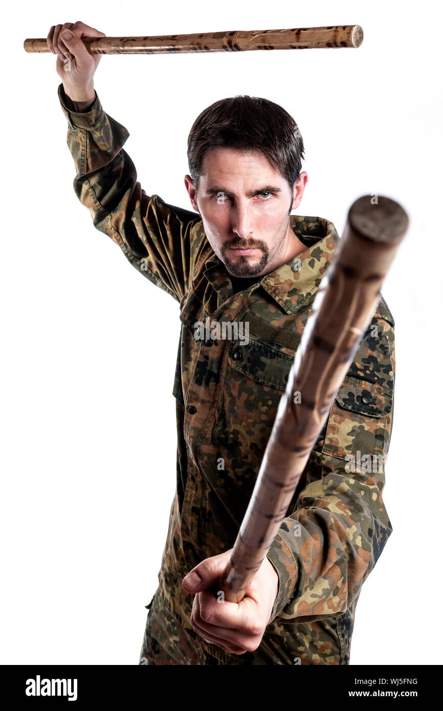Male self defense instructor with camouflage do a self defense exercise ...