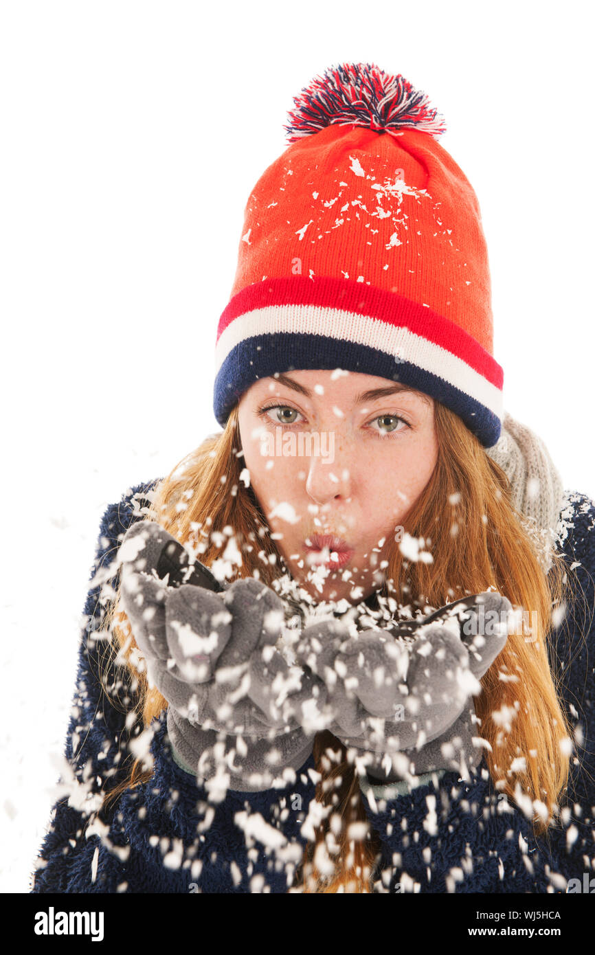 Blond young woman blowing snow hi-res stock photography and images - Alamy