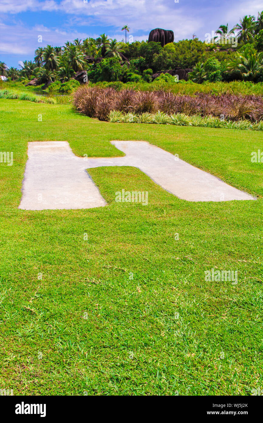 Helipad in the form of the letter H on grass in Seyshelles Stock Photo ...