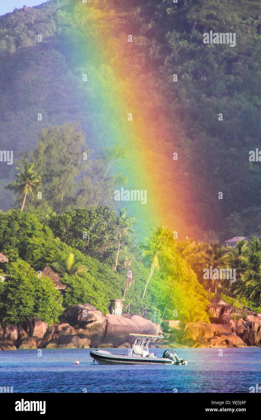 Big Rainbow over tropical island and luxurious hotel Stock Photo - Alamy