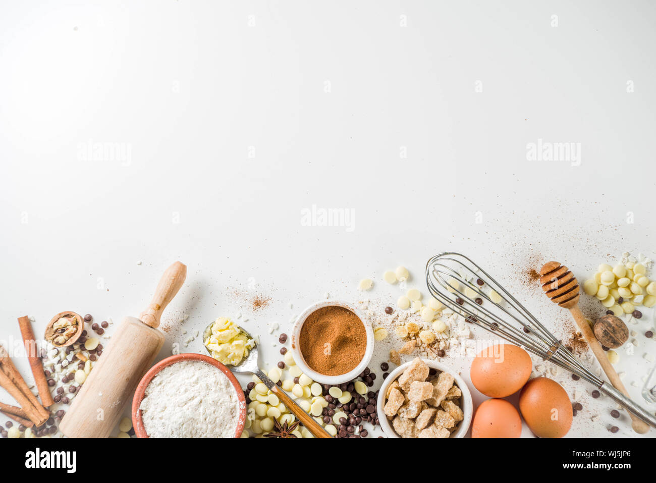 Ingredients for autumn winter festive baking - flour, brown sugar, eggs ...