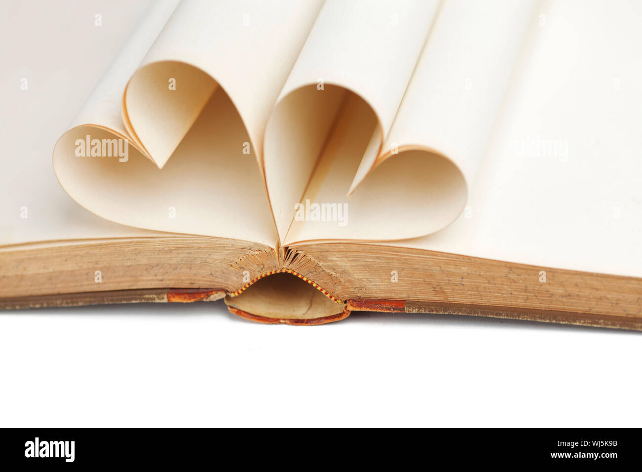 Heart made of blank pages inside a book on white background Stock Photo ...
