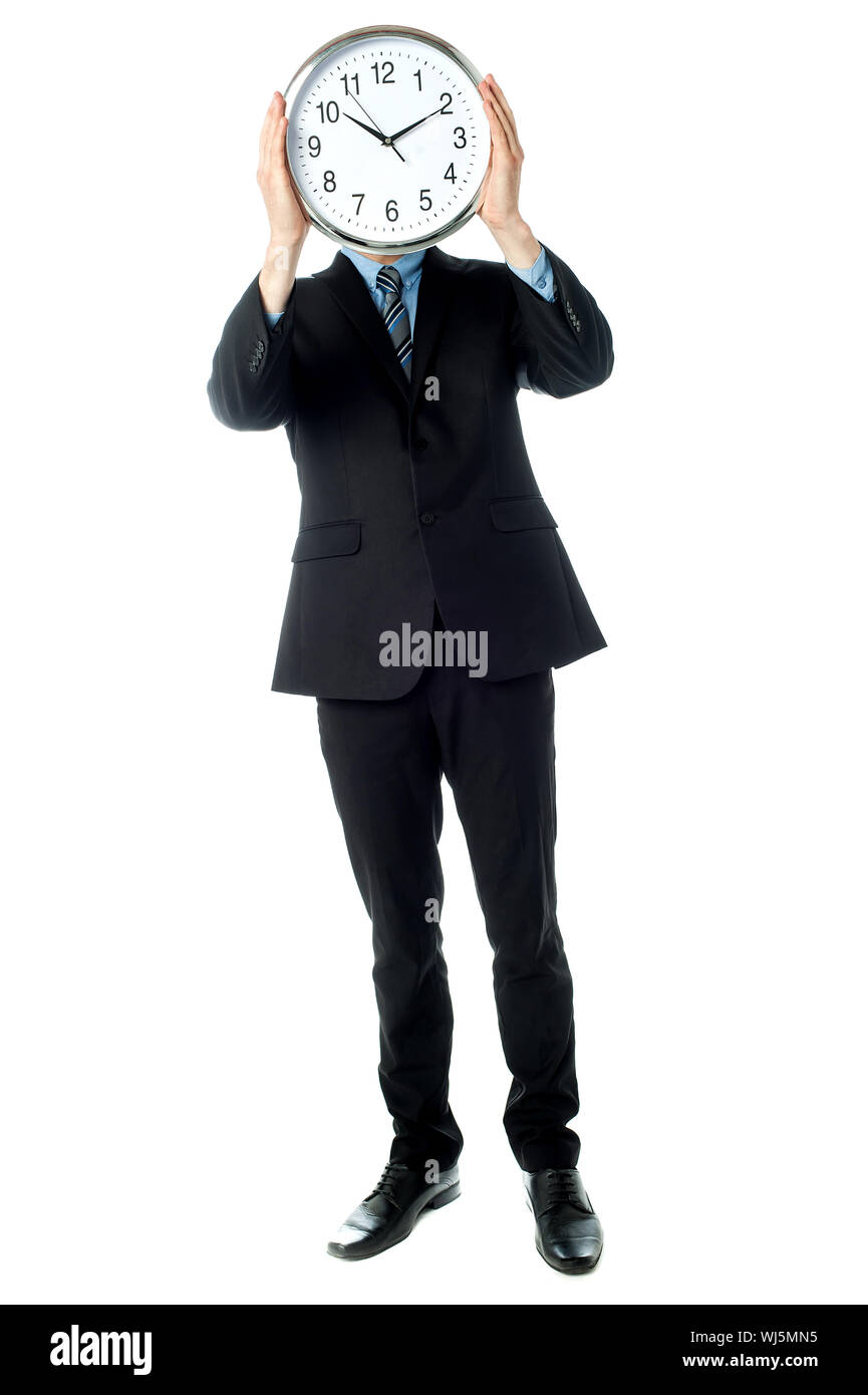 Isolated man hiding face with clock hi-res stock photography and images ...