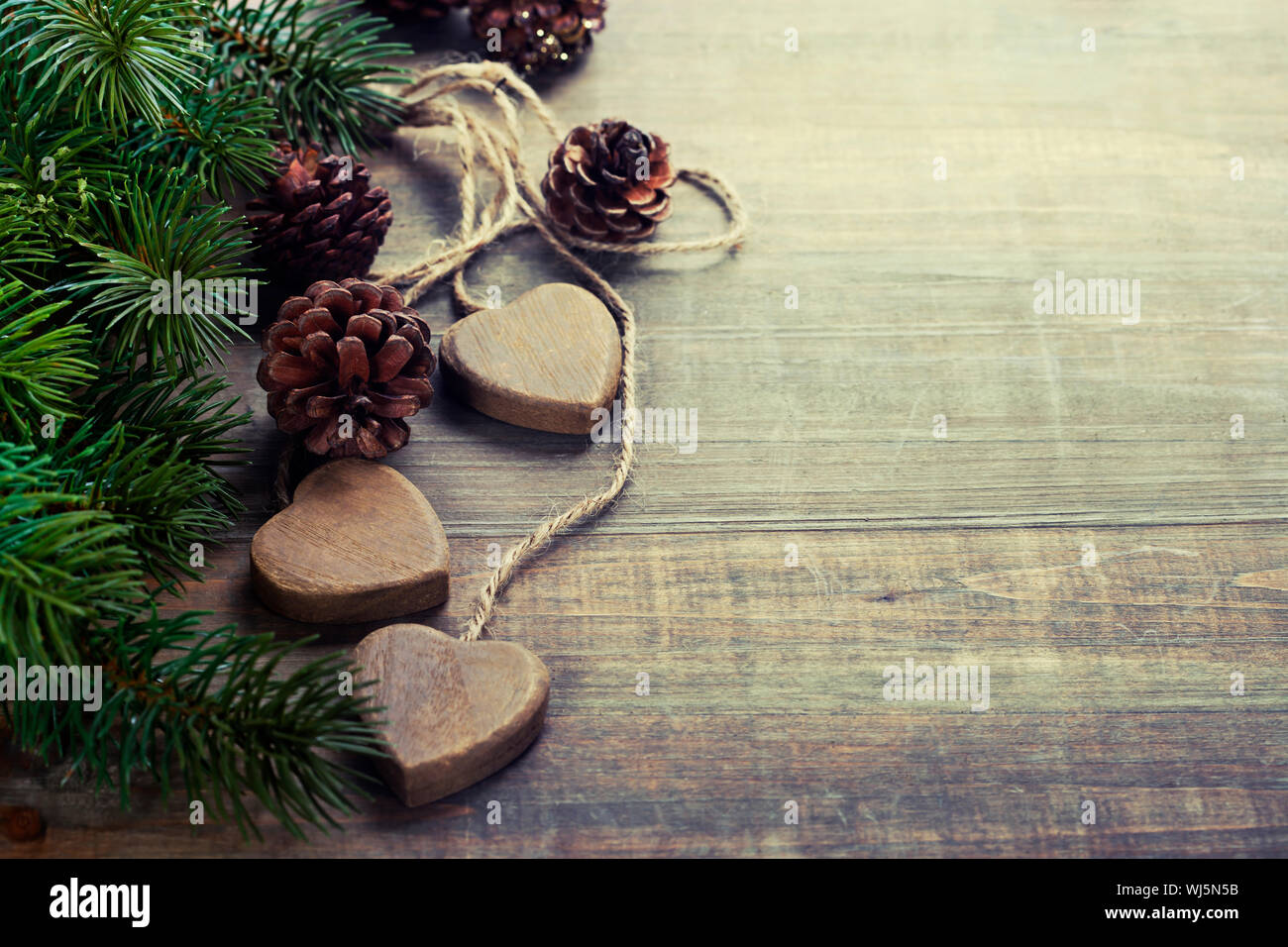 Christmas border design on the wooden background Stock Photo - Alamy