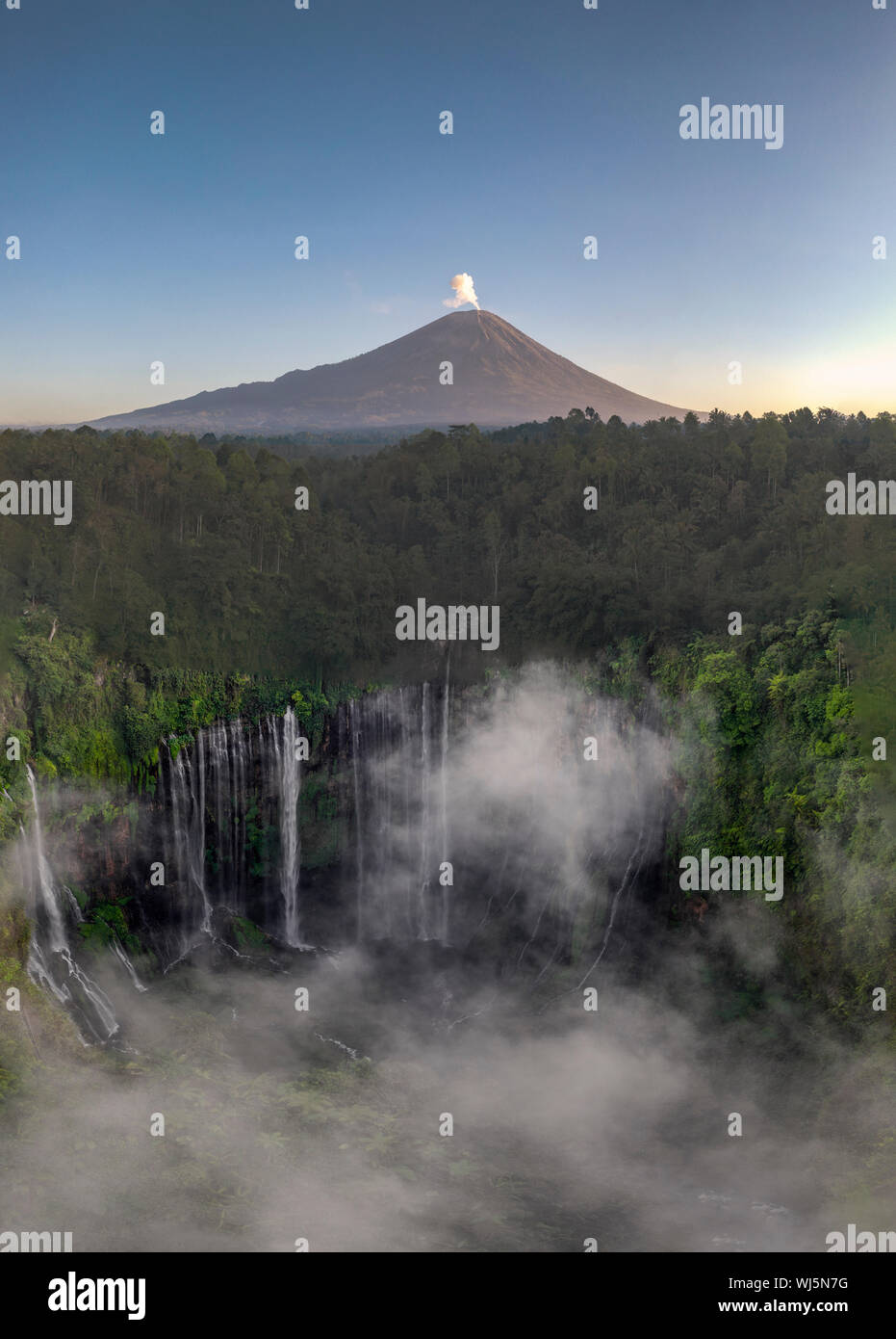 Tumpak sewu waterfall and mountain hi-res stock photography and images ...