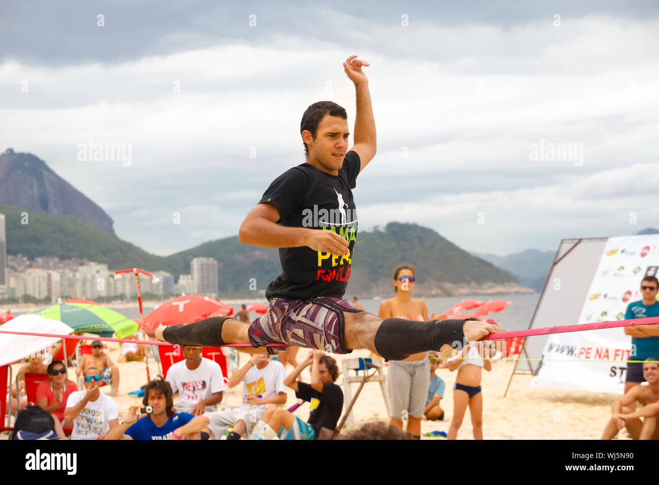 Slackline on Copacabana beach, Rio de Janeiro, Brazil Stock Photo - Alamy