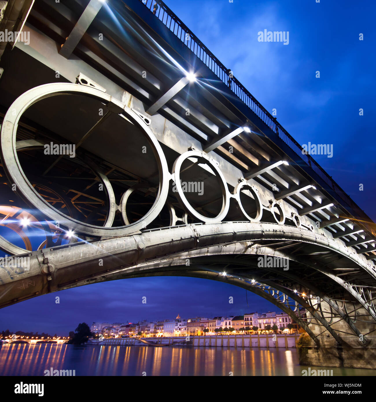 Panorama of Seville riverside at down under the Triana Bridge, the ...